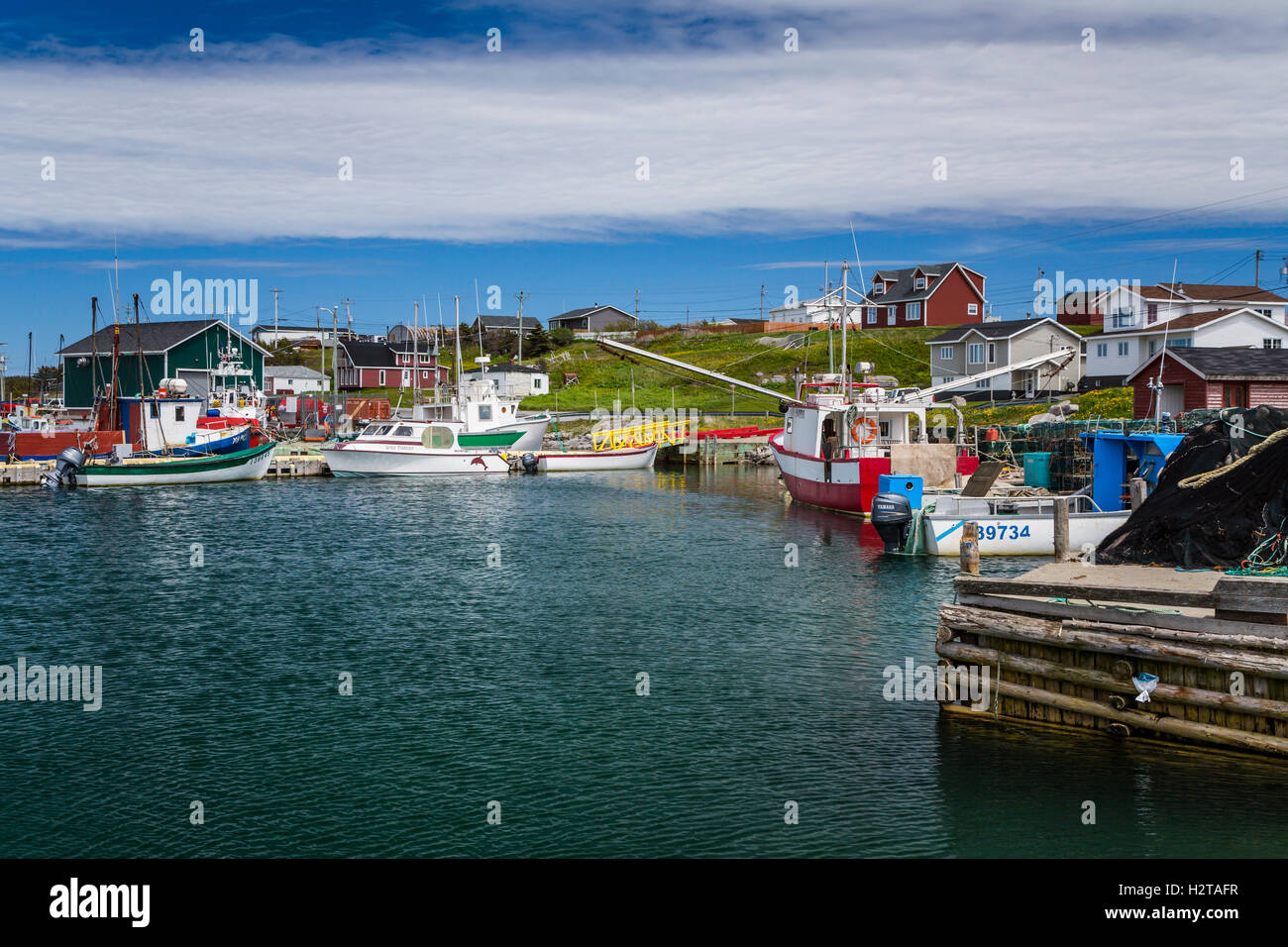 Fishing boats at the dock in the harbor of Port au Choix, Newfoundland ...