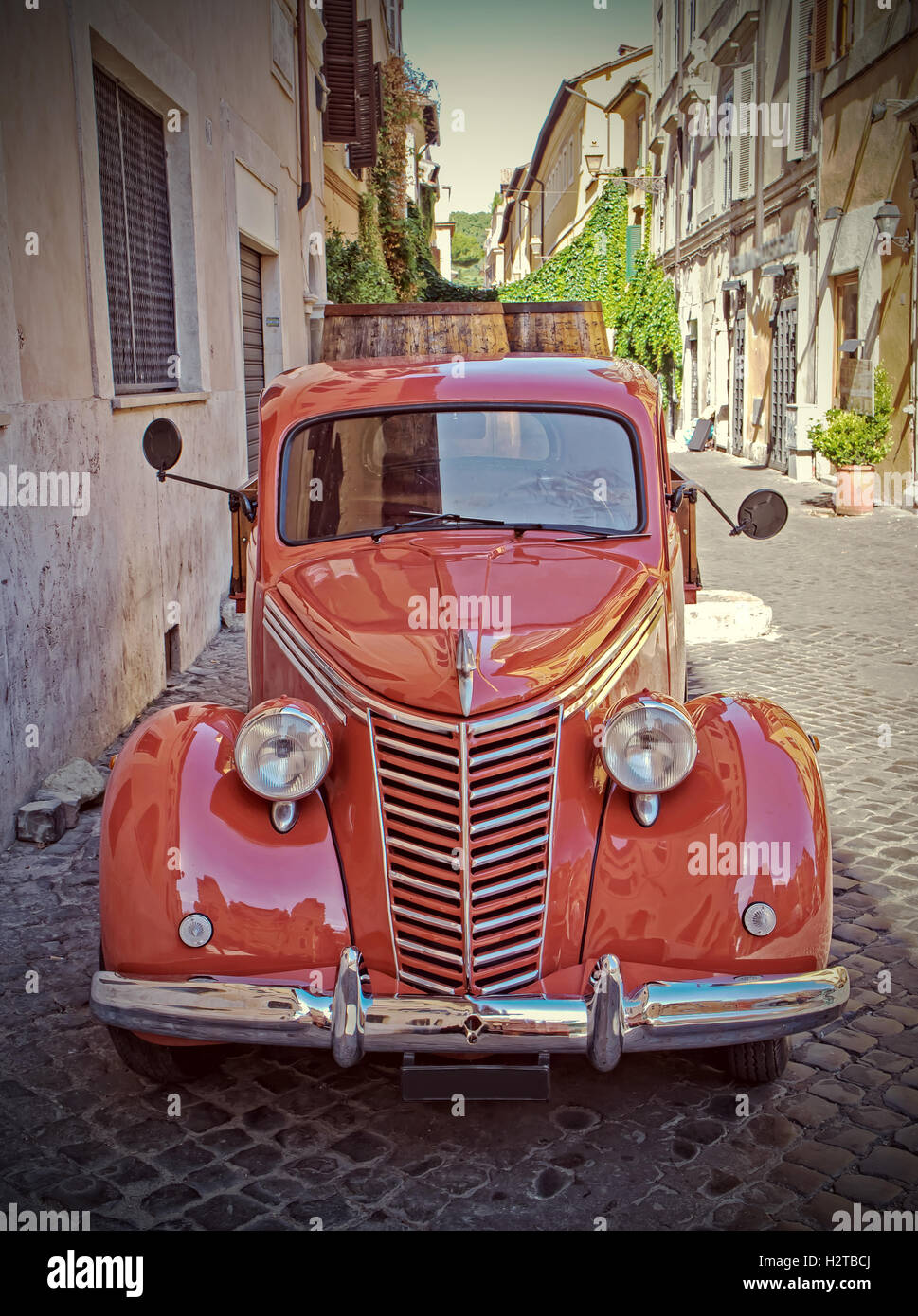 Classic car parked in an alley - Rome Italy Stock Photo - Alamy