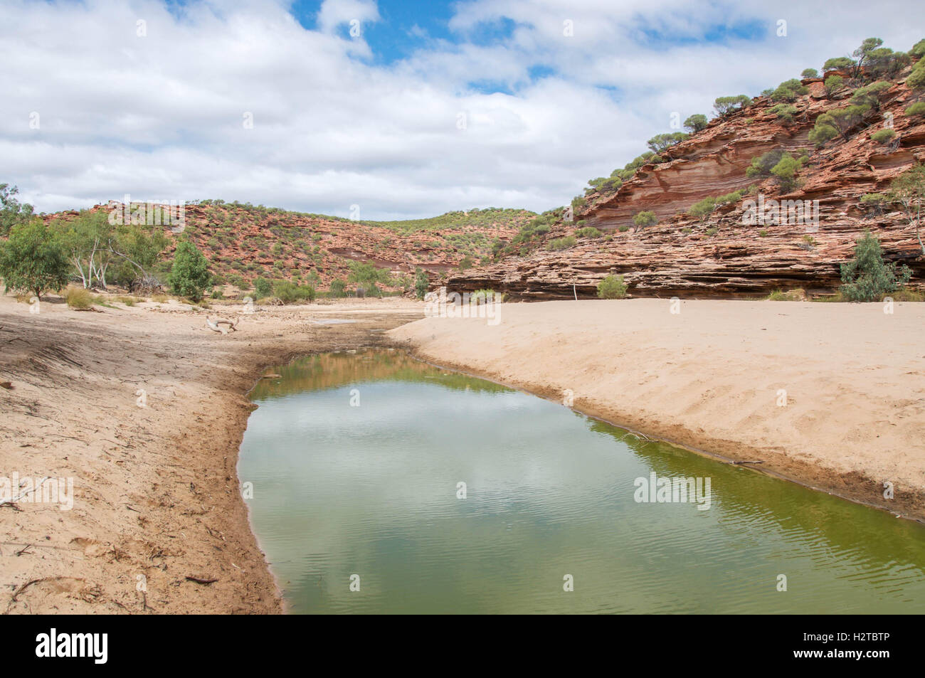 Murchison River gorge surrounded by sandstone bluffs under cloudy sky ...