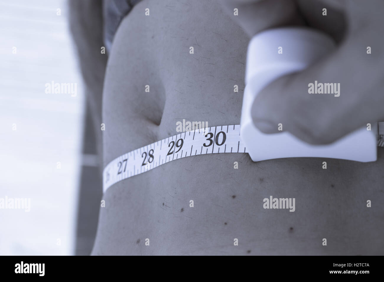 Body of a man measuring contour and body fat Stock Photo - Alamy