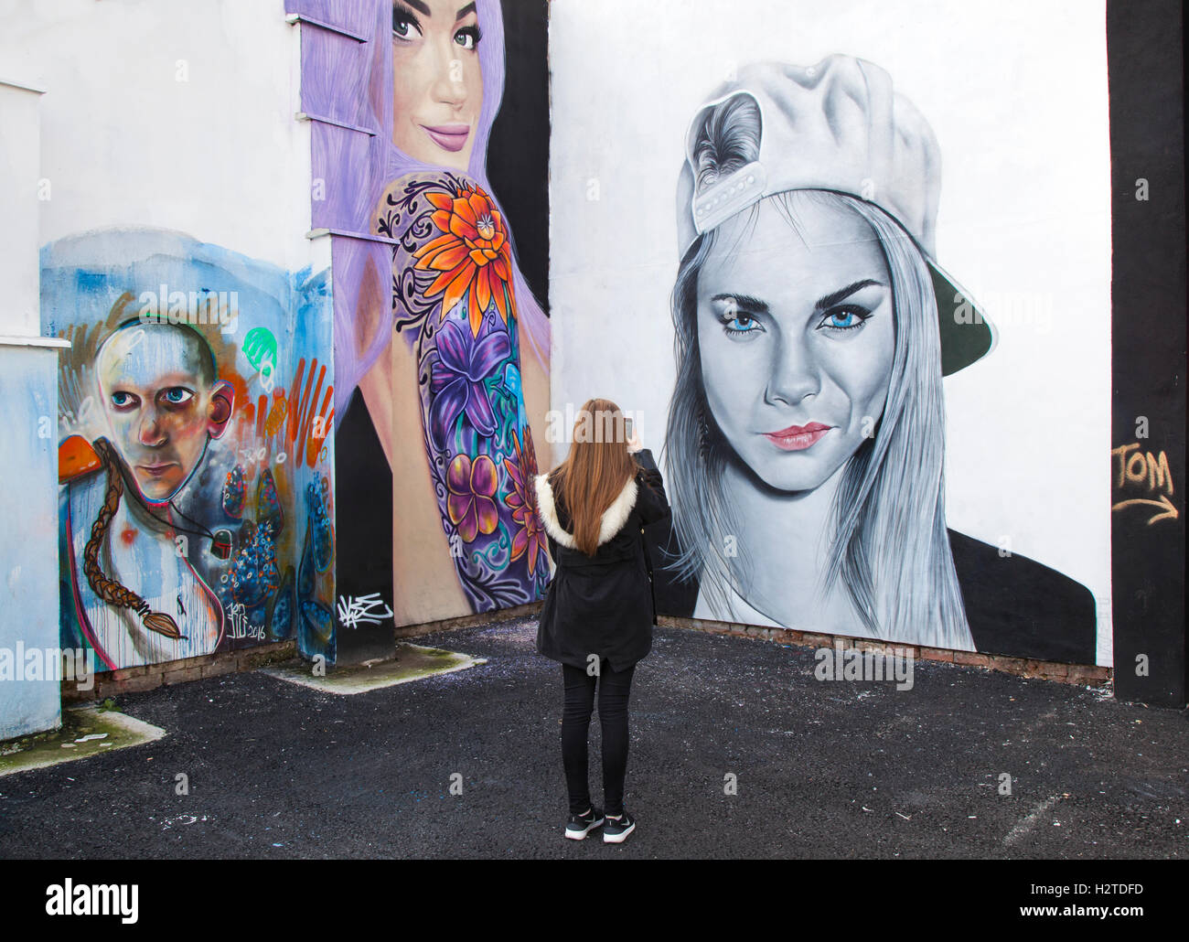 Portrait of a young modern woman, with a quizzical, bemused look. Sun ...