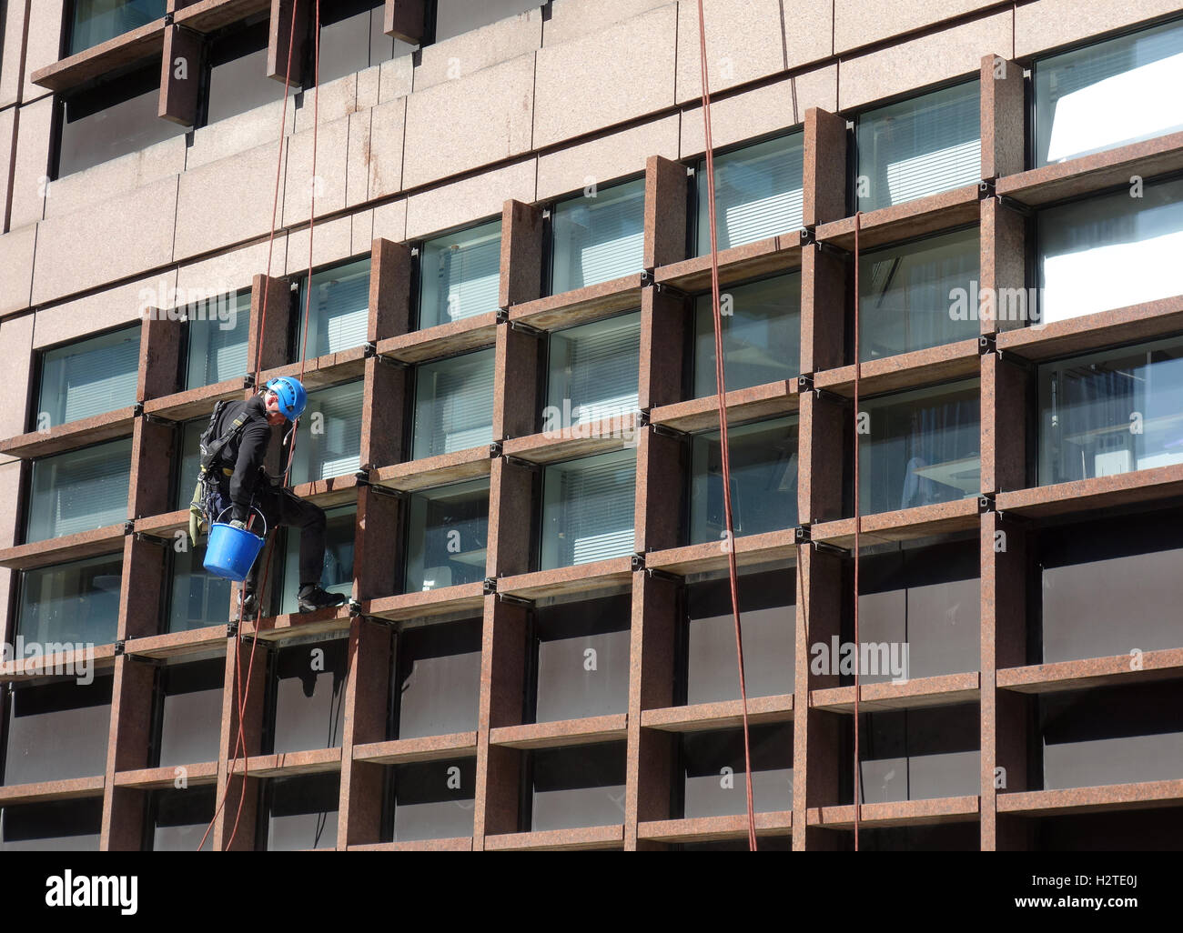Window cleaner at work on London office block Stock Photo - Alamy