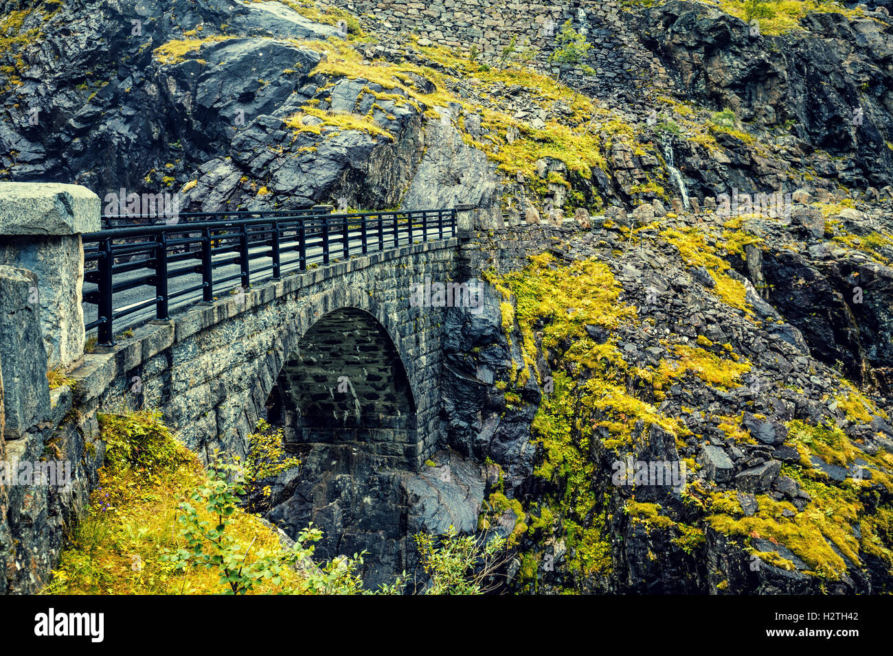 Stone bridge in mountain. Trollstigen, Trolls Path, Norway Stock Photo ...