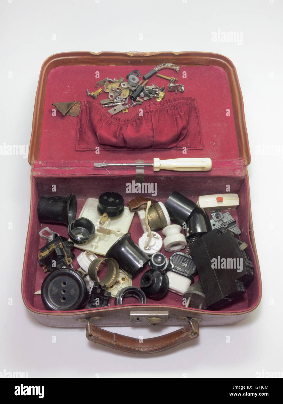Vintage suitcase full of unusual old electrical parts Stock Photo - Alamy