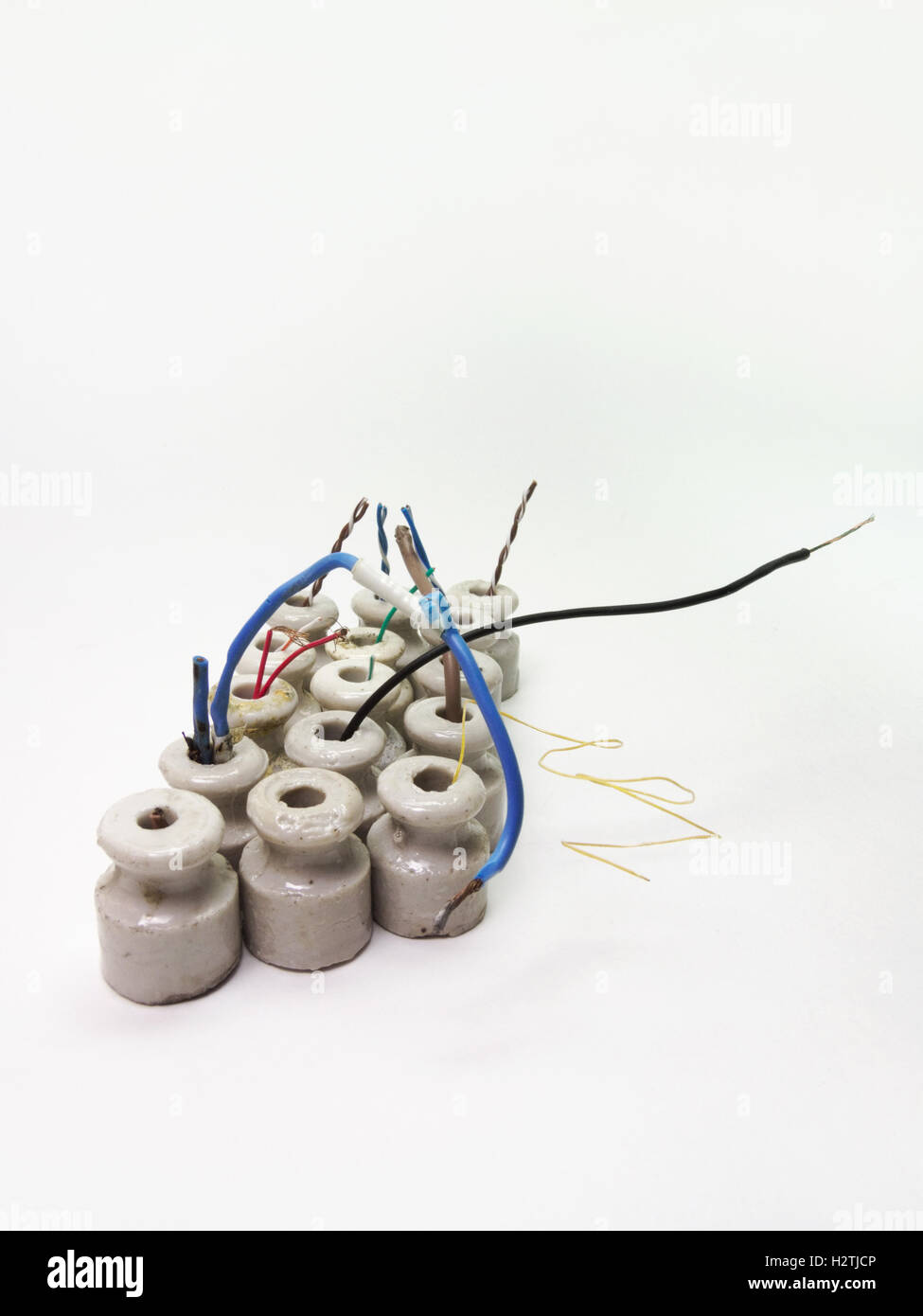 a bunch of ceramic insulators small size, bonded colored wires Stock ...