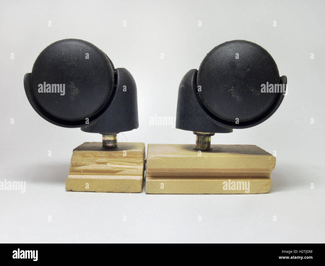 Two mounted castors for furniture Stock Photo - Alamy