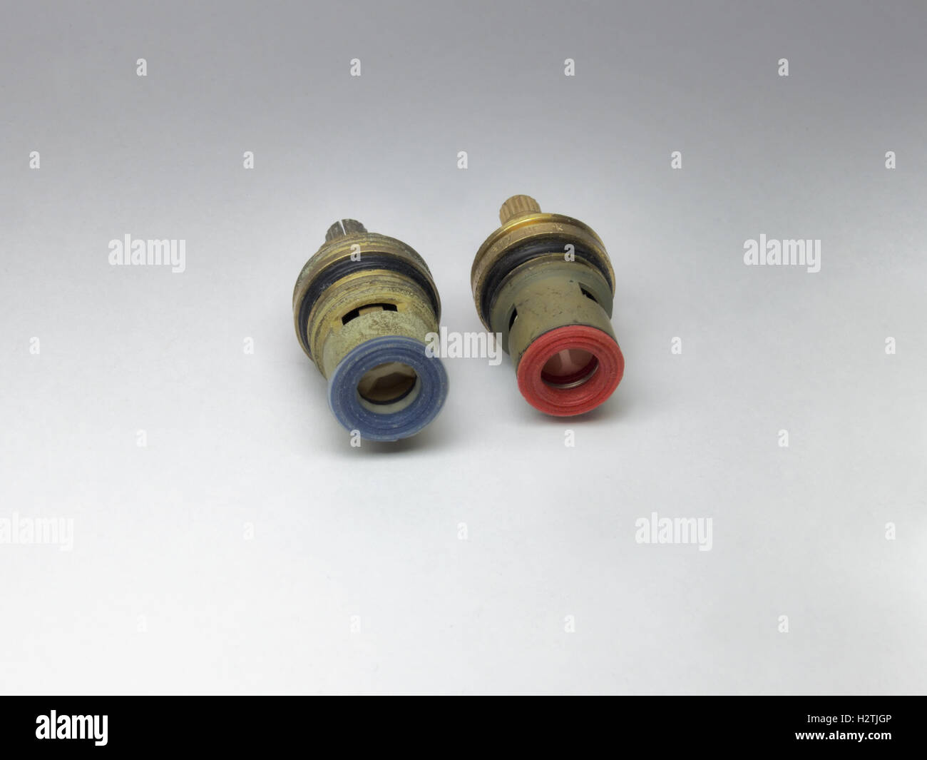 Two ceramic shut-off valves for hot and cold water Stock Photo - Alamy