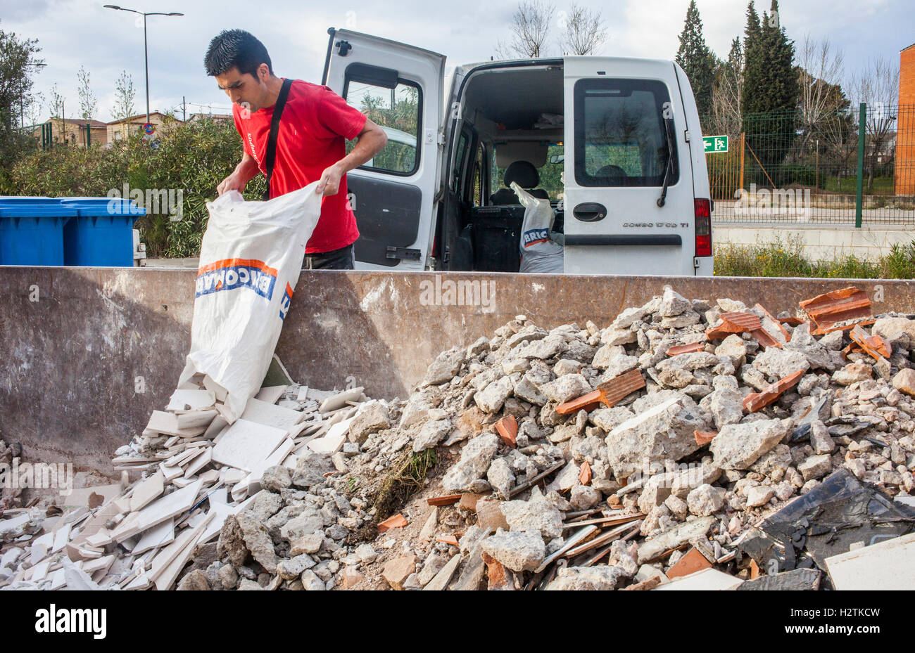 man places debris into a collector to recycle,recycling center Stock ...
