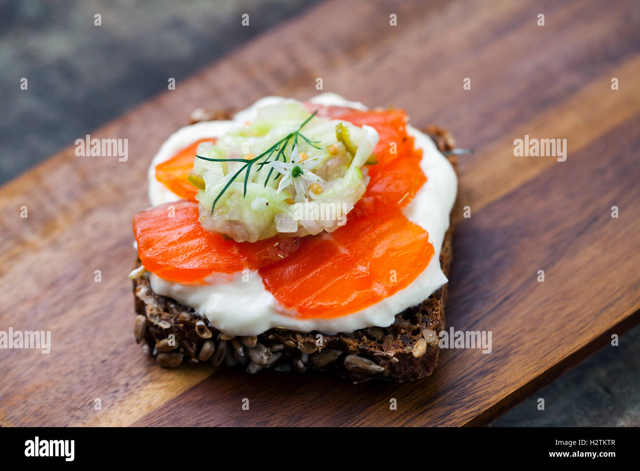 Scandinavian dark bread with cured trout , micro herbs, cucumber ...