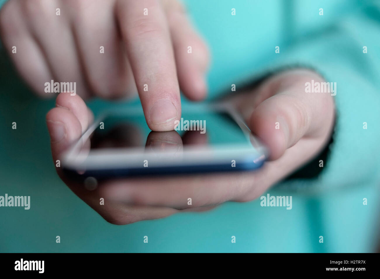 Person holding smart phone in hands to communicate and text Stock Photo ...