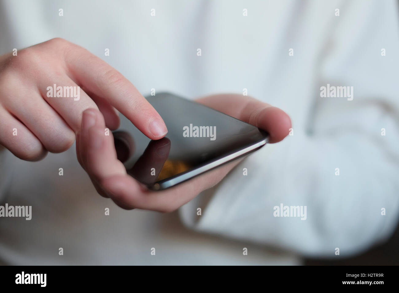 Person holding smart phone in hands to communicate and text Stock Photo ...