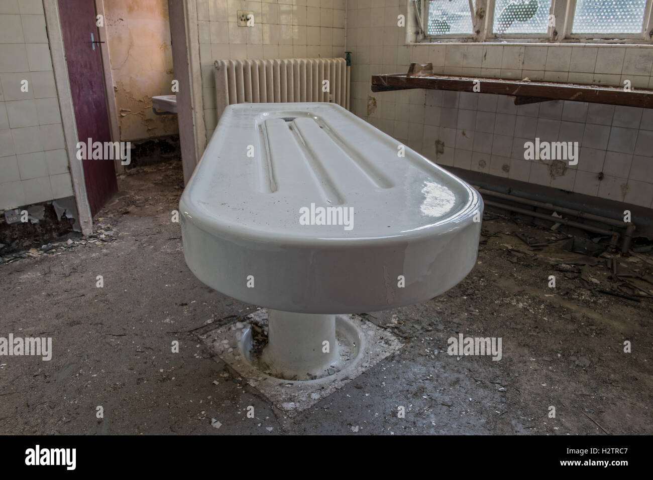 An increasingly rare porcelain autopsy table within the derelict Maiden ...