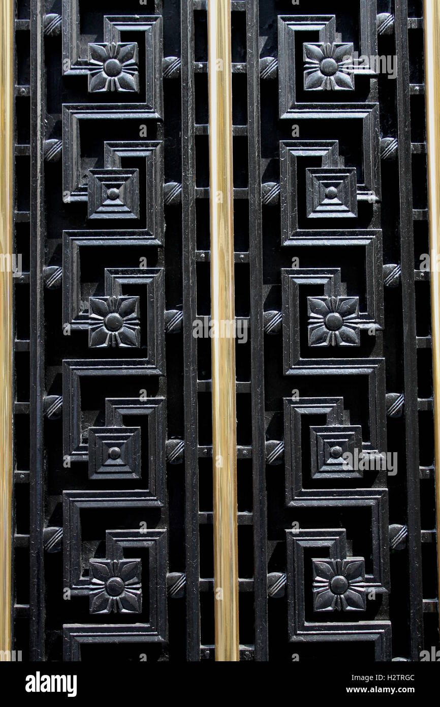 A black, wrought iron decorative grate on a window in New York City ...