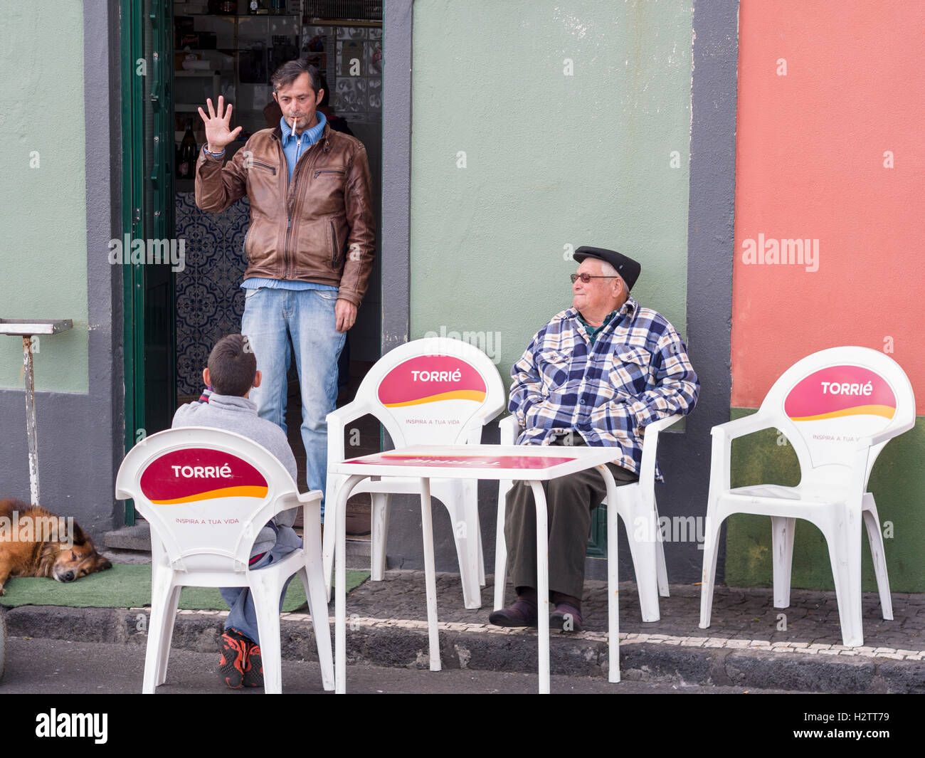 High Fives -- cafe scene. A man, smoking in a doorway gives a high five ...