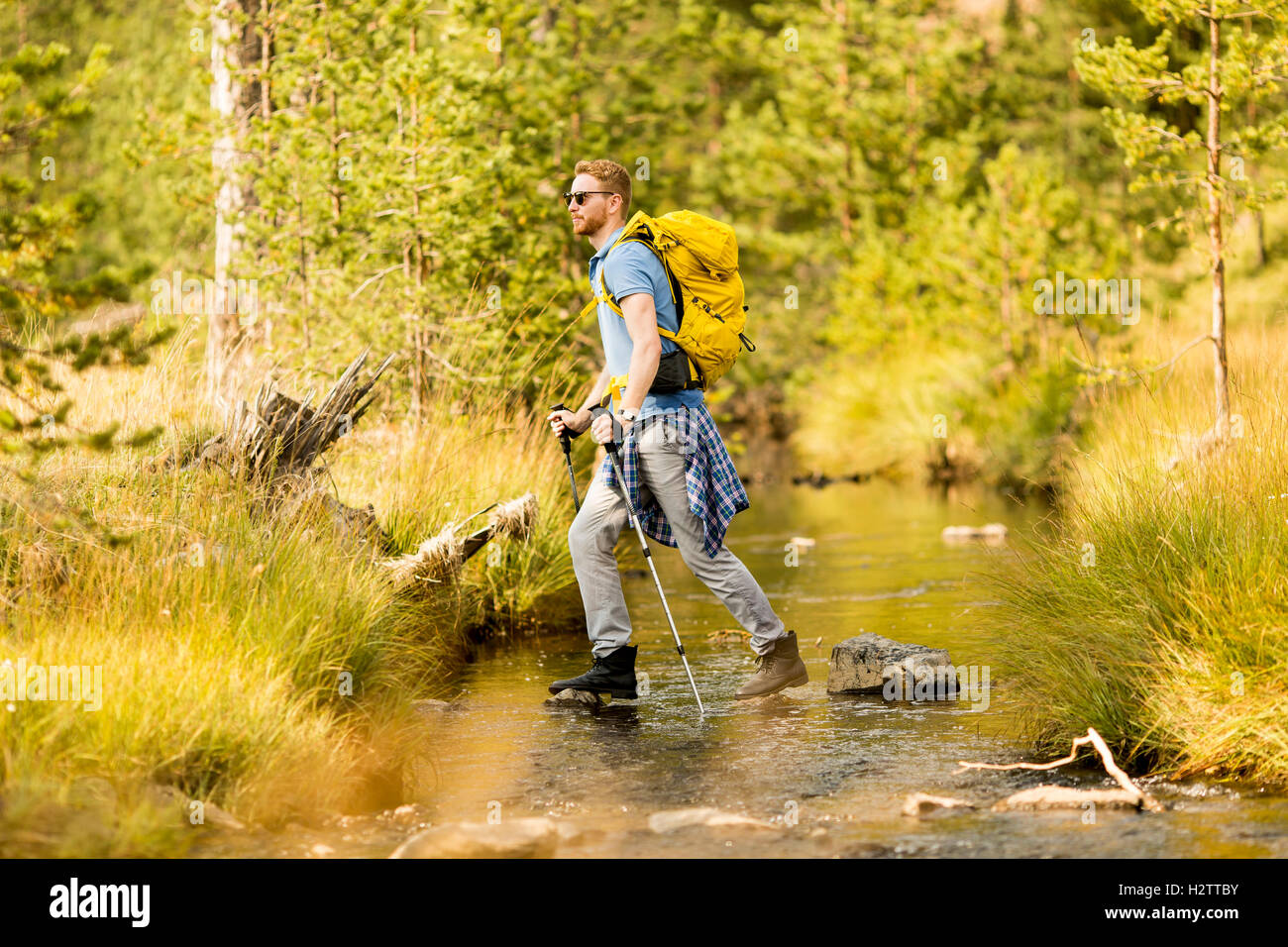 Young man crosses mountain hi-res stock photography and images - Alamy