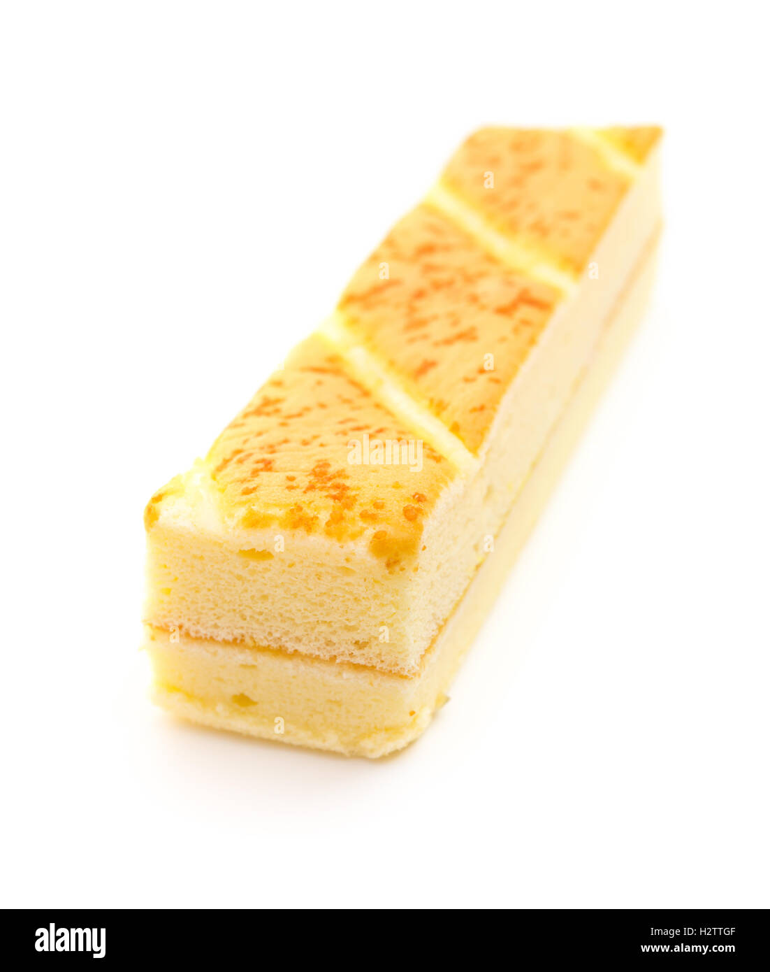 sweet long sponge cake on a white background Stock Photo - Alamy