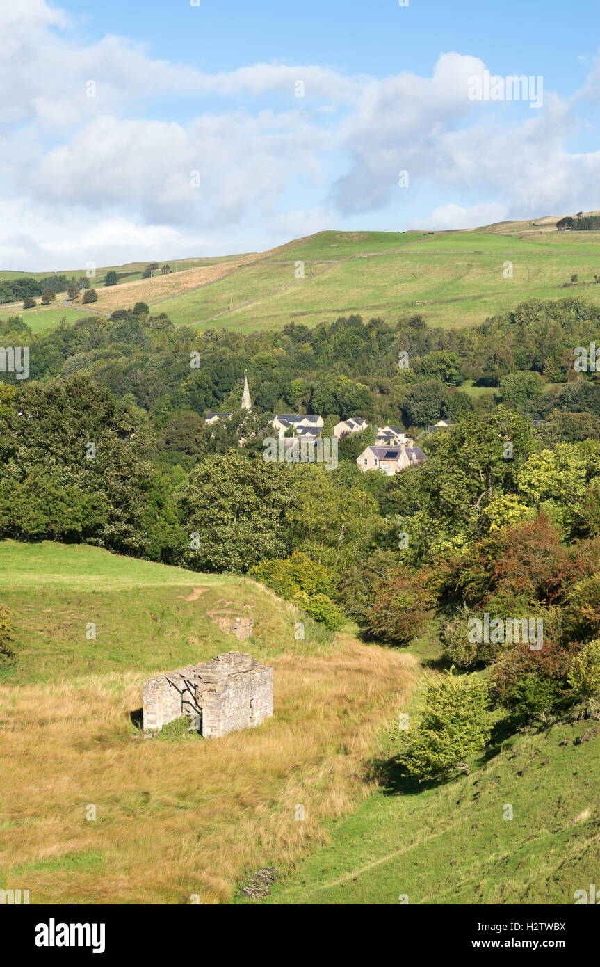 The remains of a disused quarry with Frosterley village in the ...