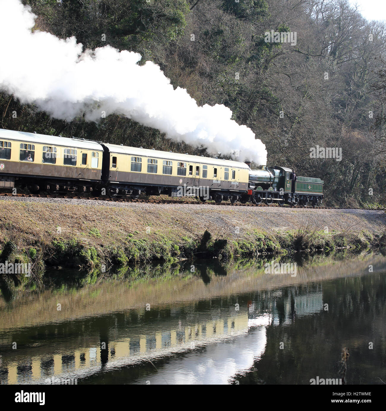 Steam locomotive, 3205, pulling a passenger train alongside the River ...