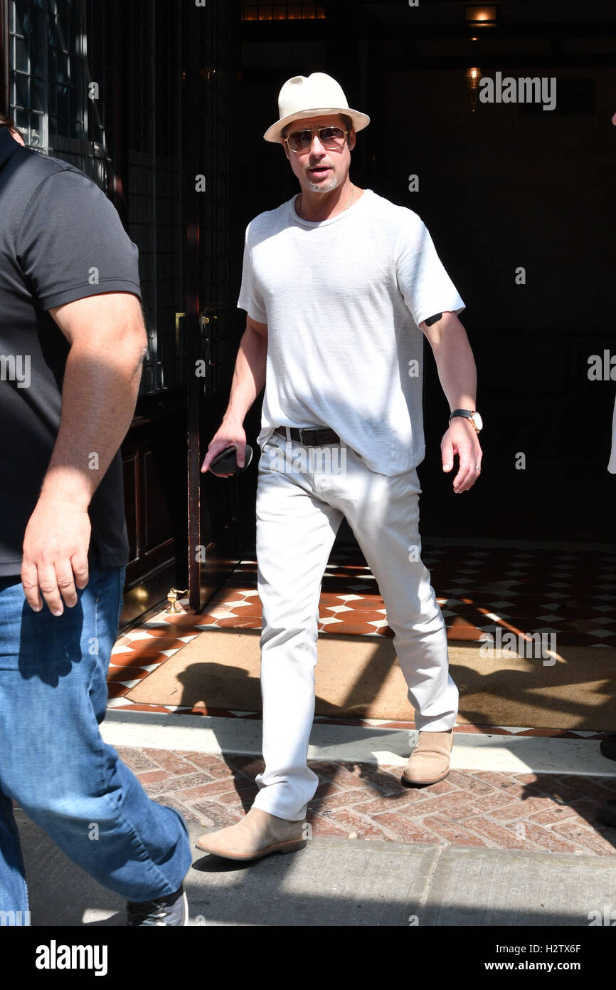 Brad Pitt out and about in New York wearing a white outfit and hat ...