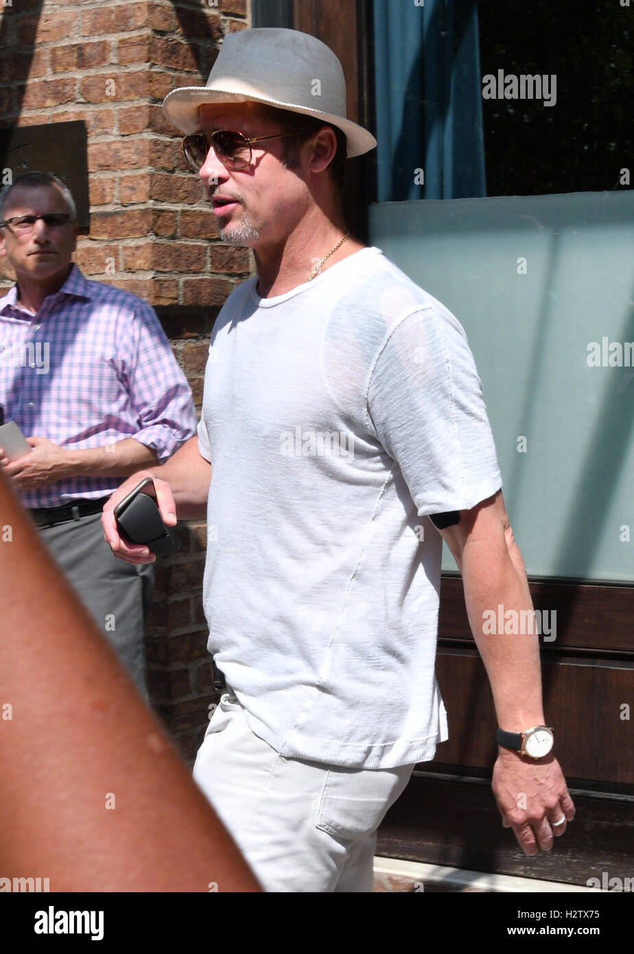 Brad Pitt out and about in New York wearing a white outfit and hat ...