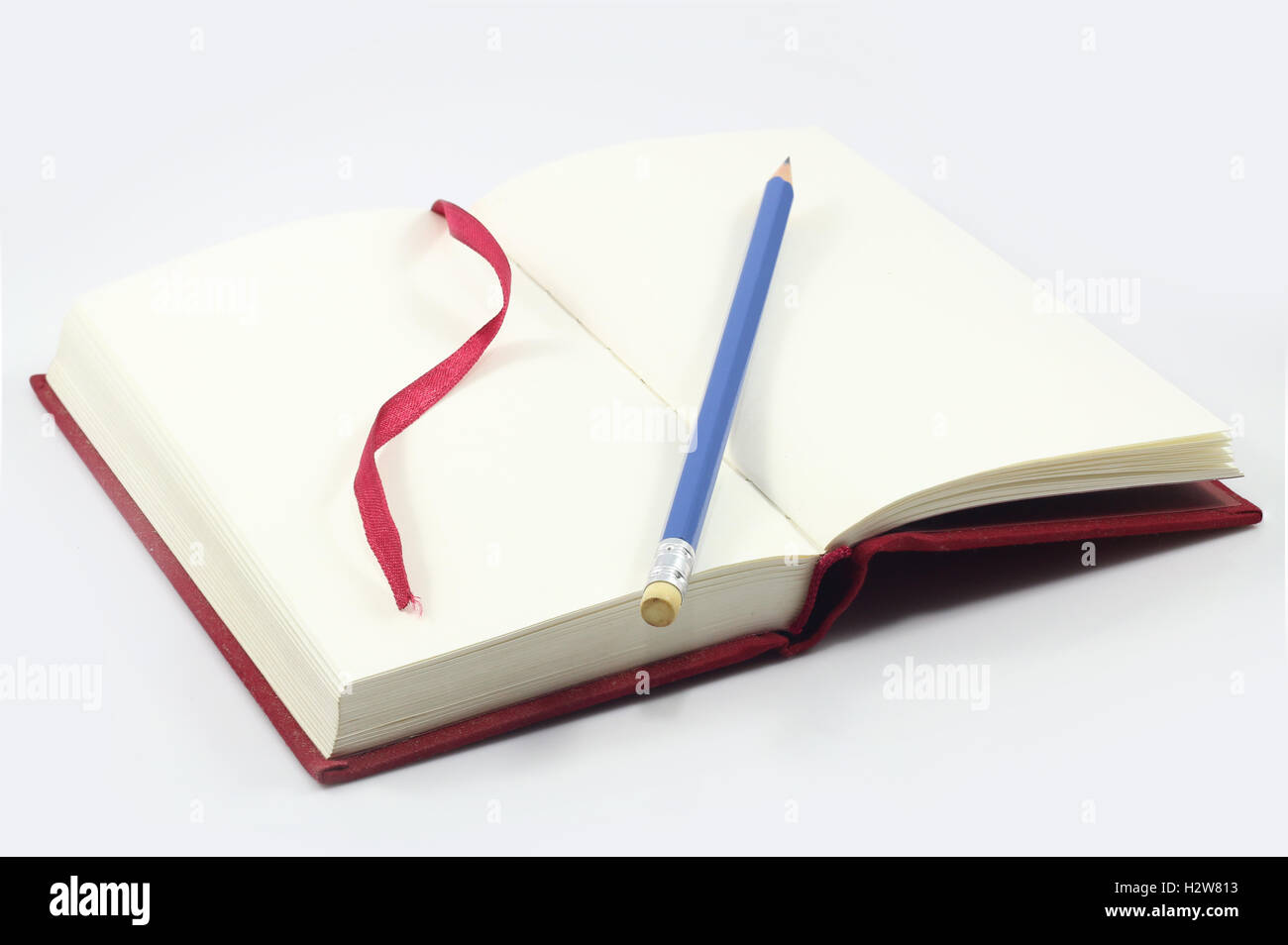 red notebook and blue pencil on white background Stock Photo - Alamy