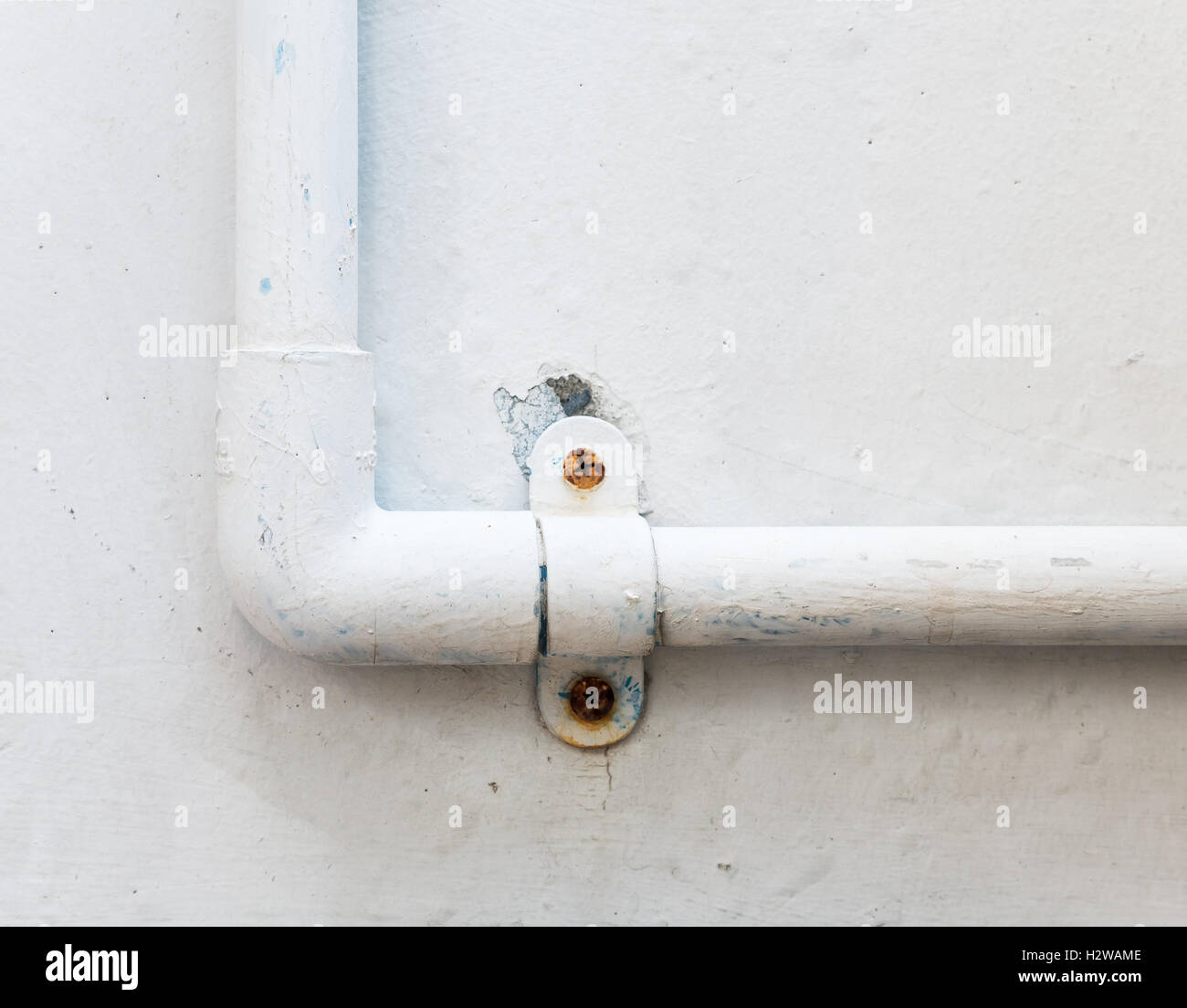 White PVC pipe on the wall for the faucet in the urban house Stock ...