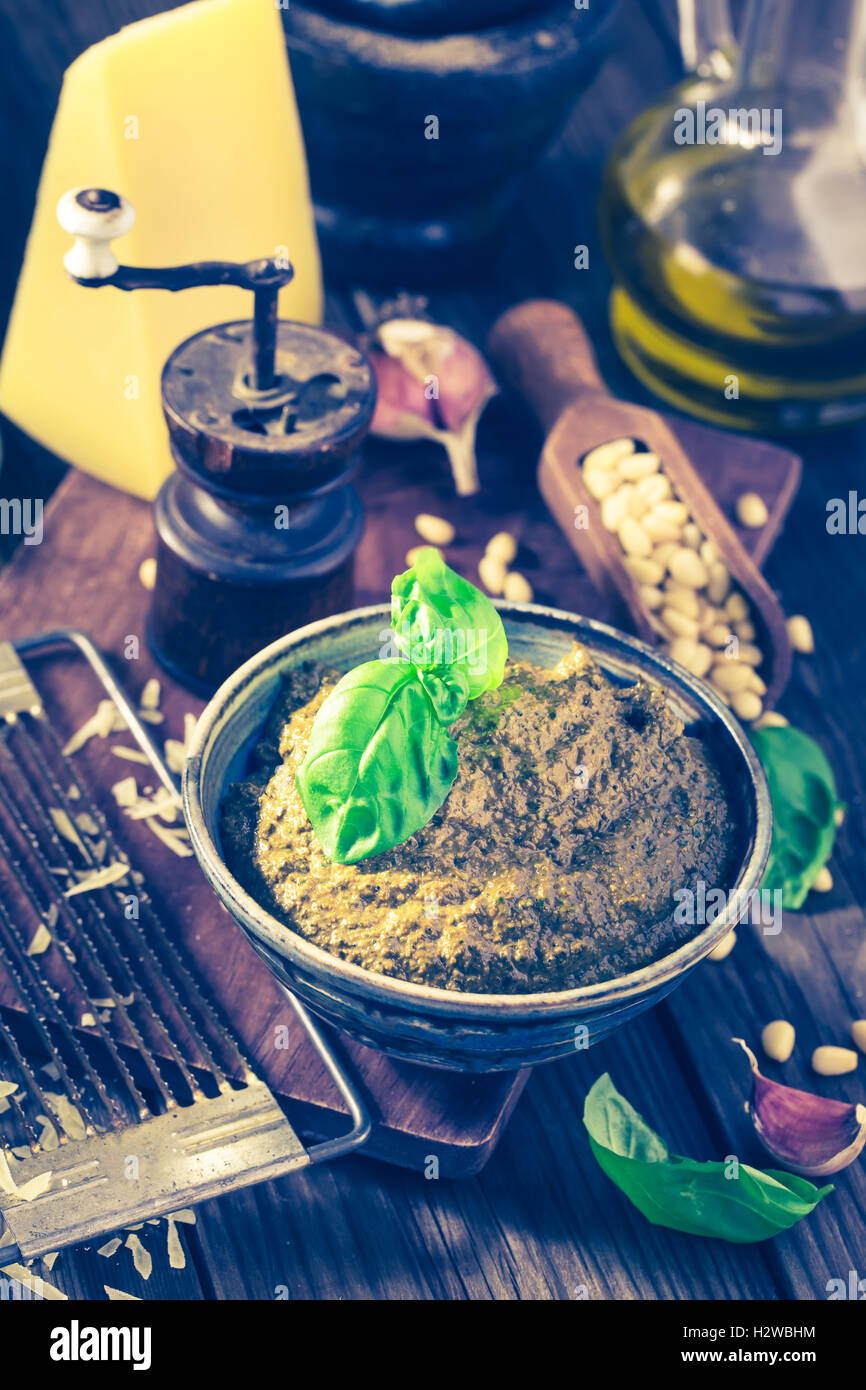 Fresh italian basil pesto toned Stock Photo - Alamy