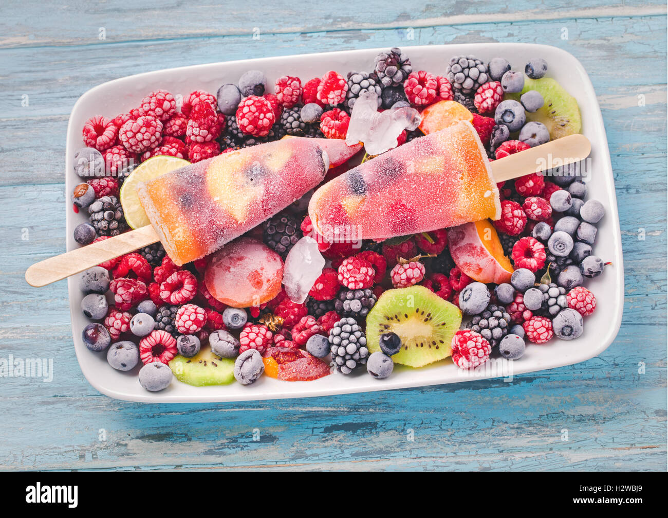 Ice pops on frozen berries Stock Photo - Alamy
