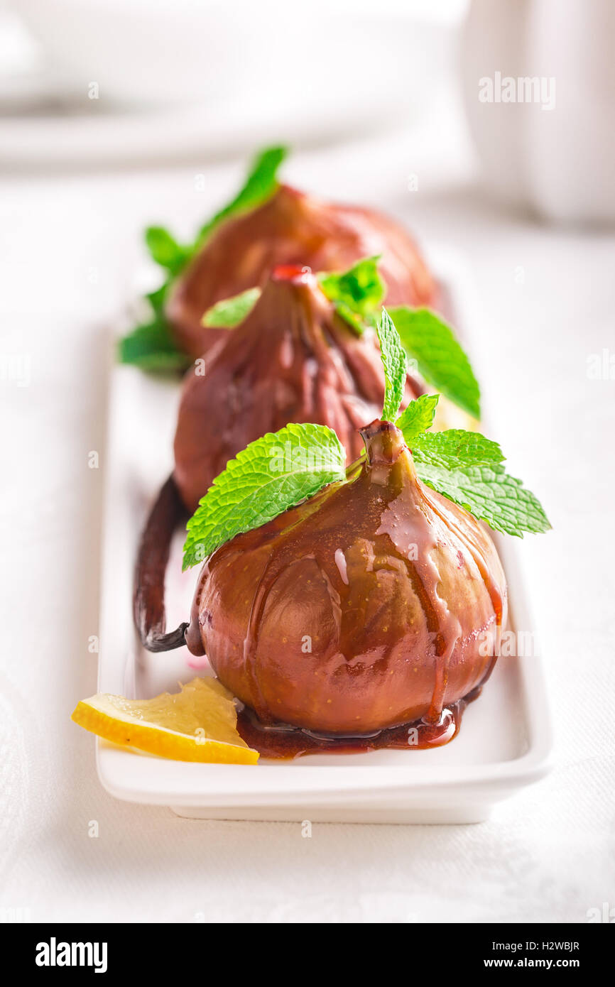 Poached fig in red wine with honey Stock Photo - Alamy