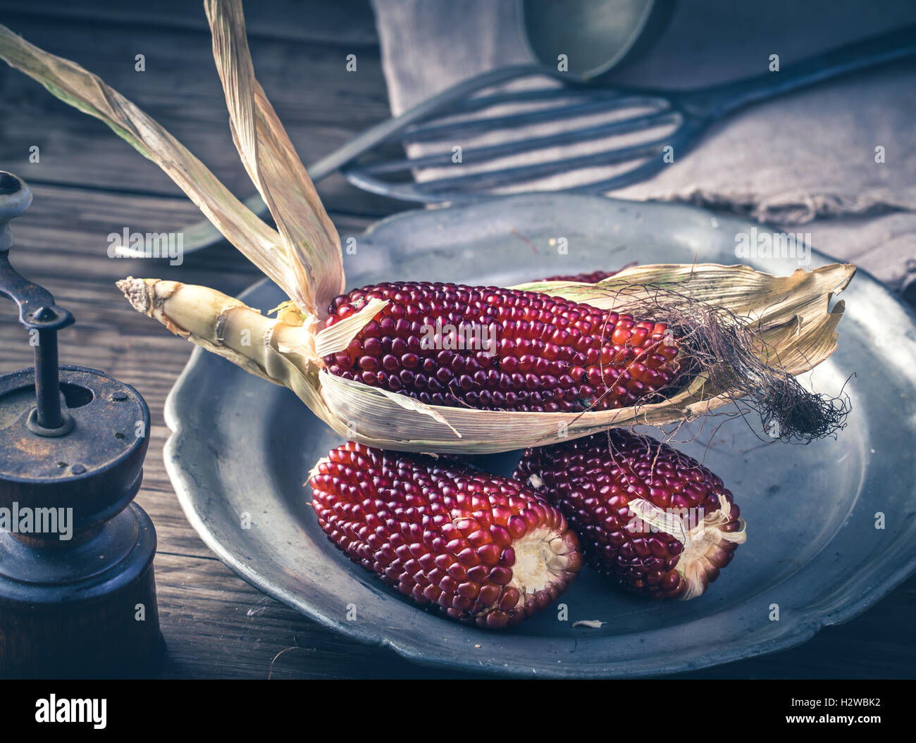 Red corn cobs on plate Stock Photo - Alamy