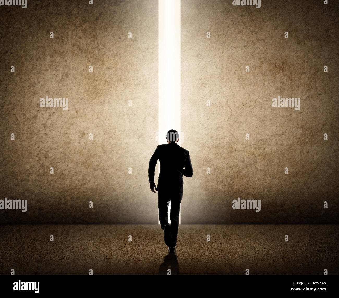 Businessman running to the future Stock Photo - Alamy