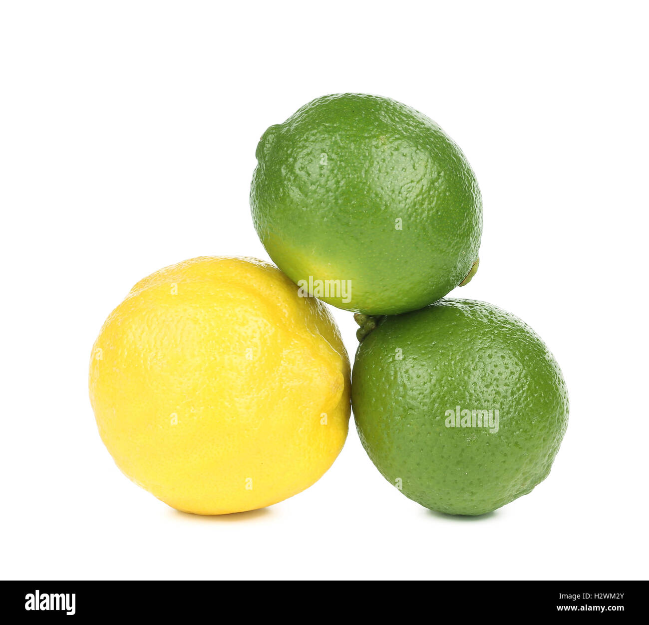 Two lime and one lemon Stock Photo - Alamy