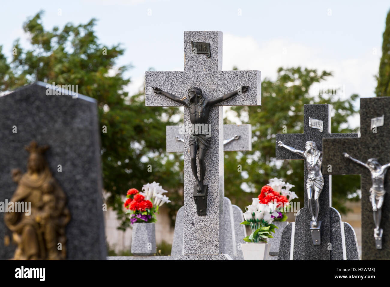 Jesus Christ on the cross in a cemetery Stock Photo - Alamy