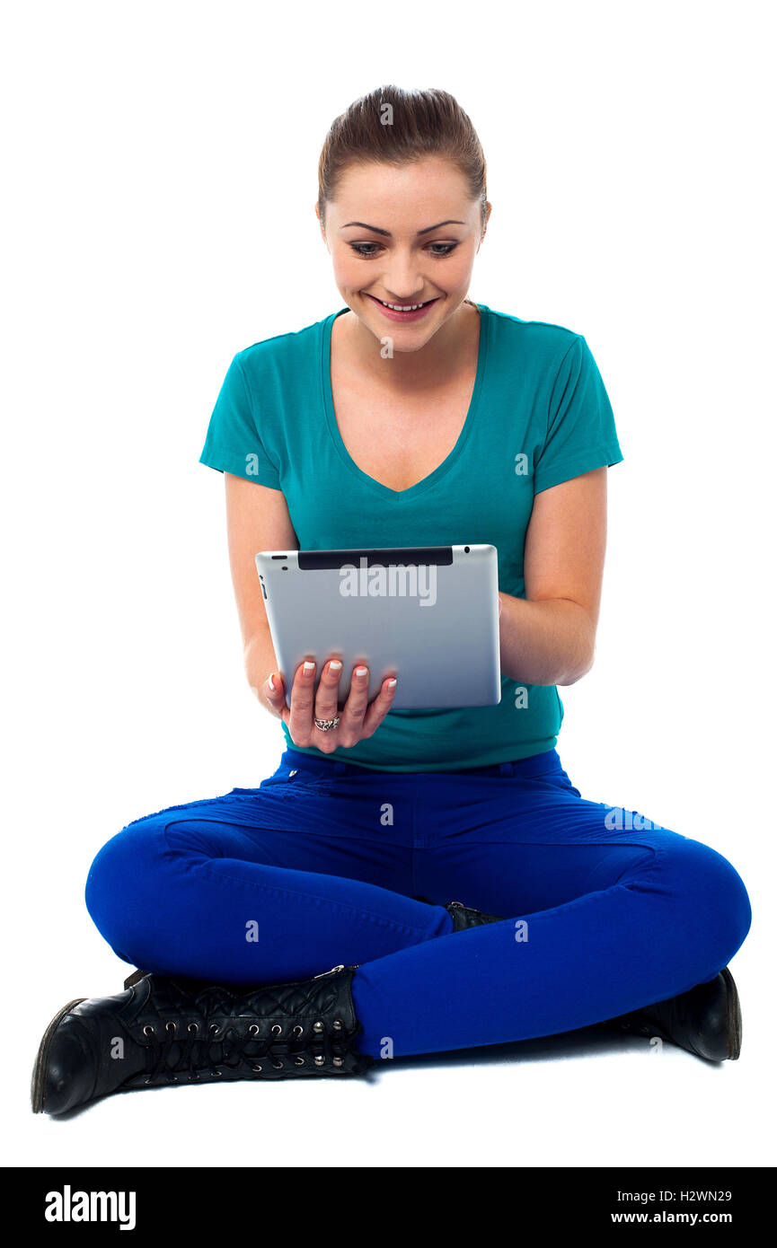 Young lady using tablet pc Stock Photo - Alamy