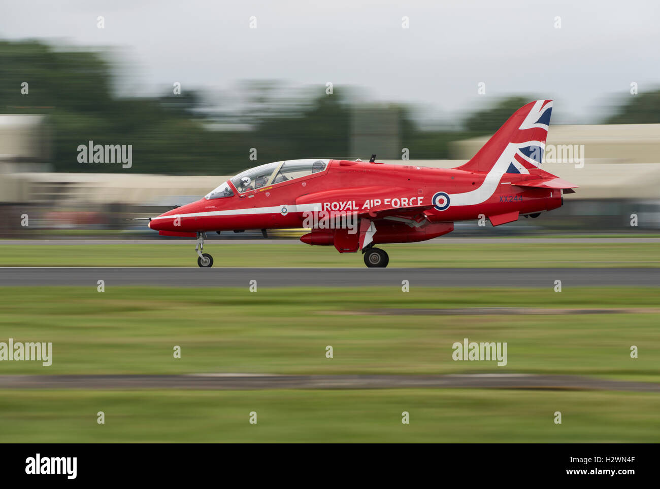 A RAF Red Arrows military aerobatic display team Hawk jet trainer lands ...
