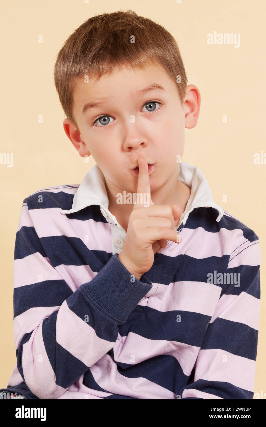 The secret. Finger over mouth. Psst Stock Photo - Alamy