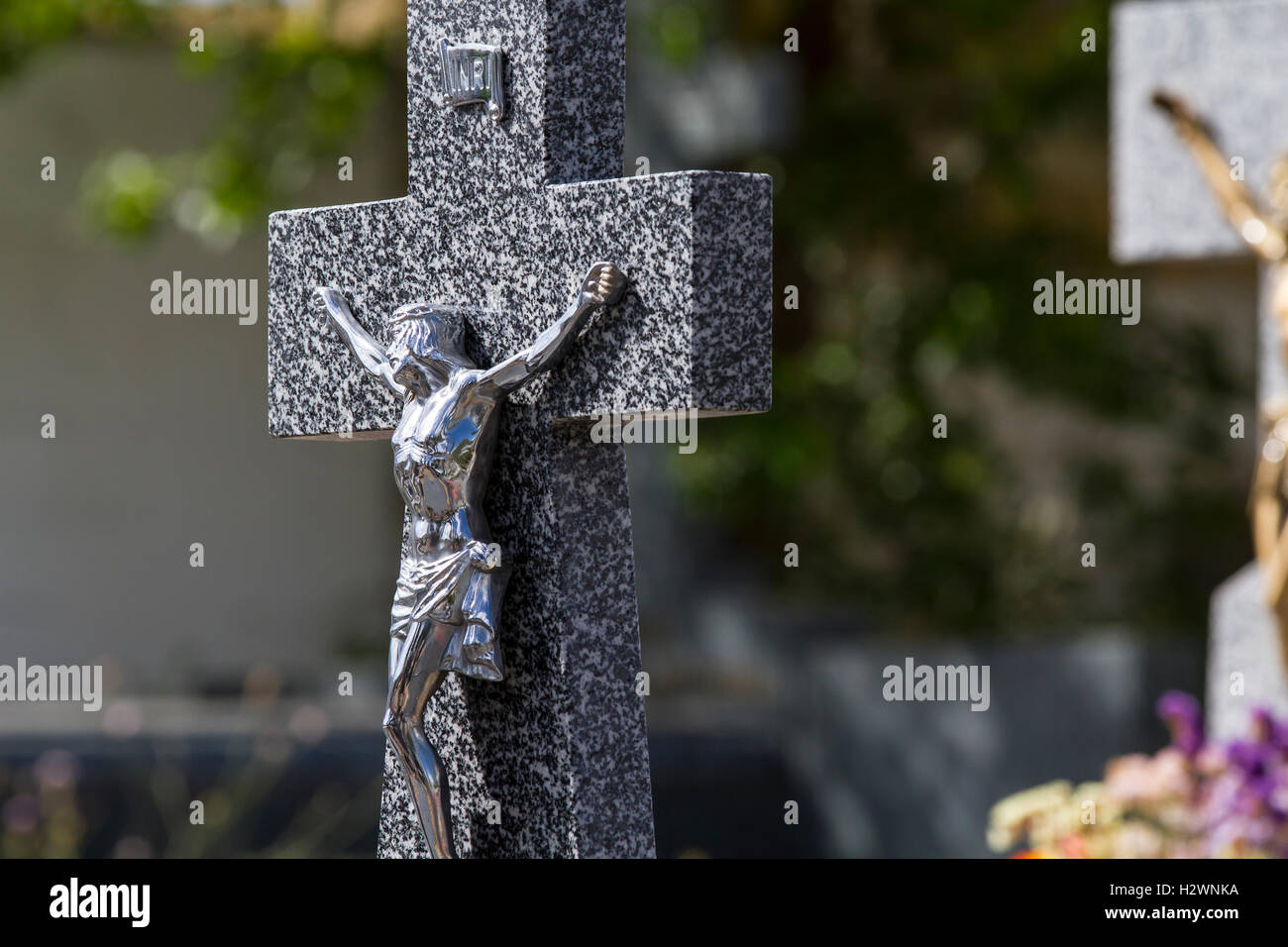Jesus Christ on the cross in a cemetery Stock Photo - Alamy