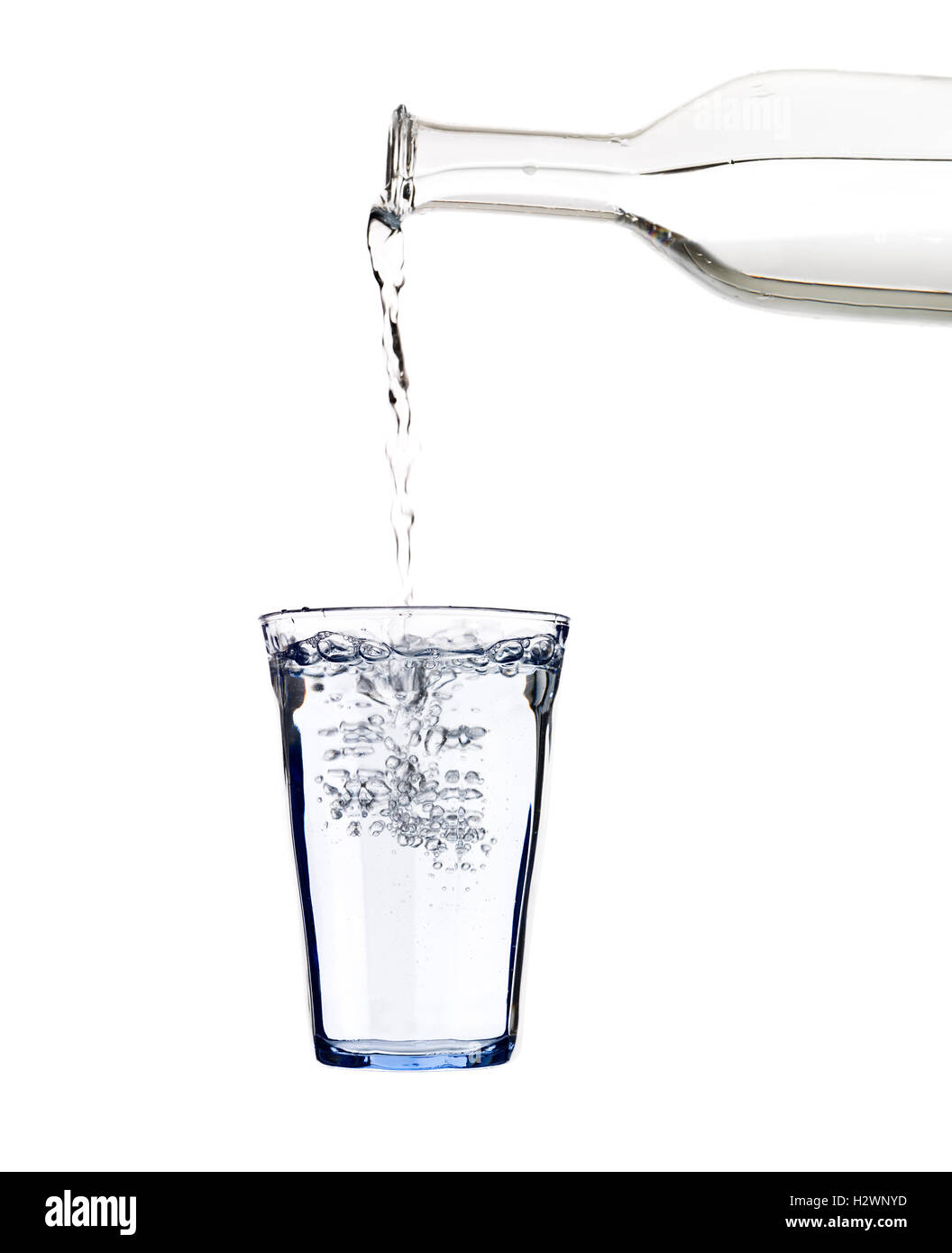 Pouring water overflowing glass Cut Out Stock Images & Pictures - Alamy