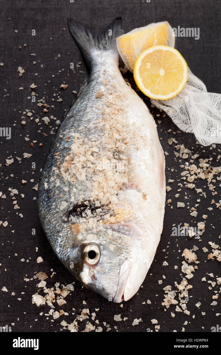 Fish, lemon and sea salt Stock Photo - Alamy