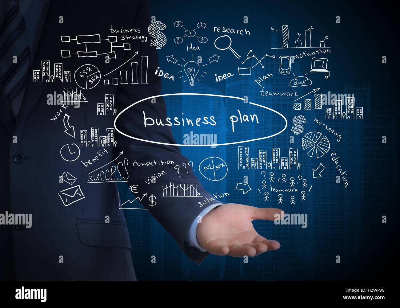 Man in suit holding business plan Stock Photo - Alamy