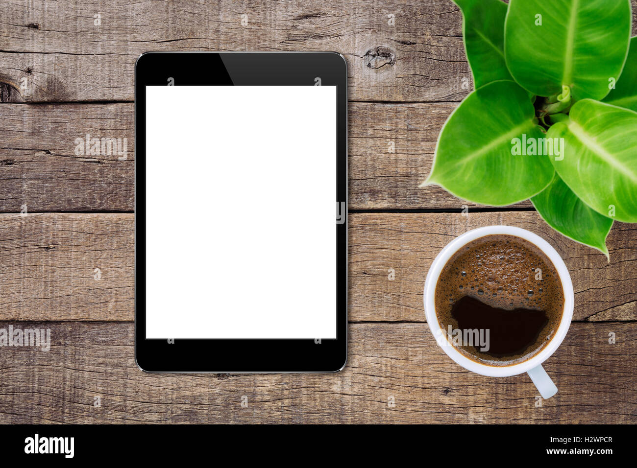 digital tablet on wood table top view, tablet white screen for adjust ...