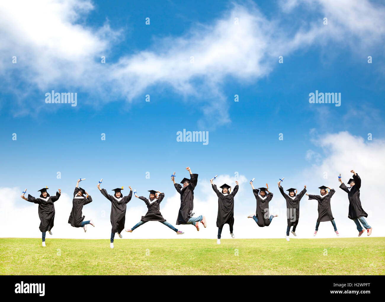Students graduate jump hi-res stock photography and images - Alamy