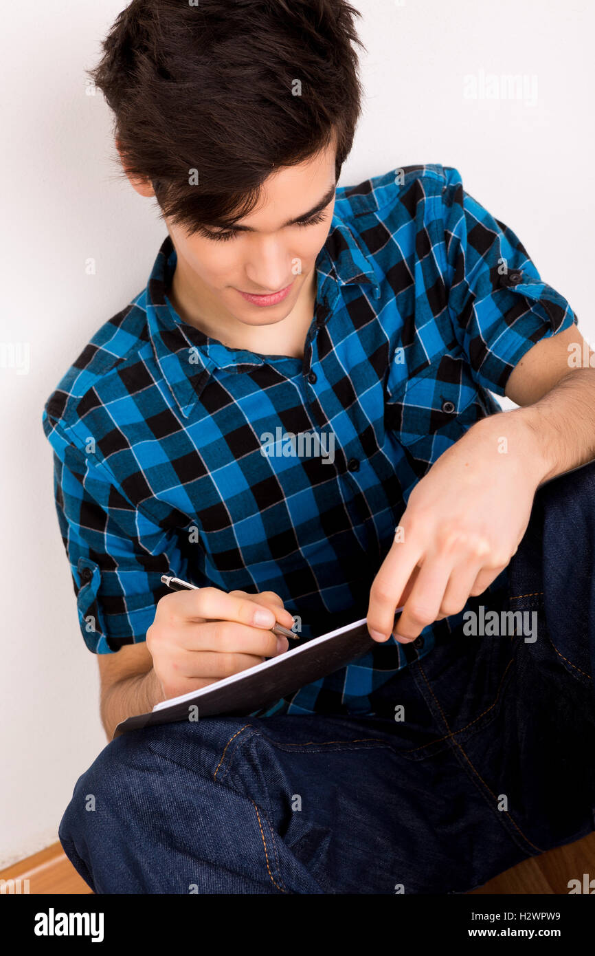 Young man studying at home Stock Photo - Alamy