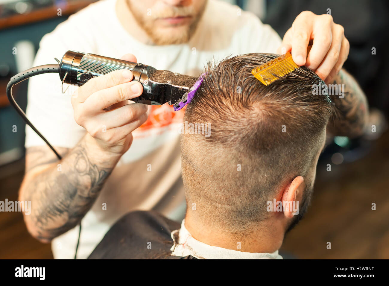 Young man having hair cutted Stock Photo - Alamy