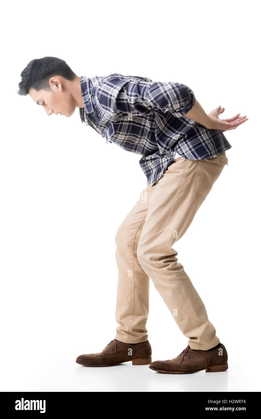 Asian young guy carry or take something Stock Photo - Alamy