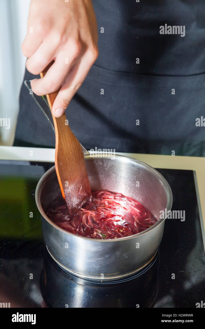 Man cooking sauce Stock Photo - Alamy