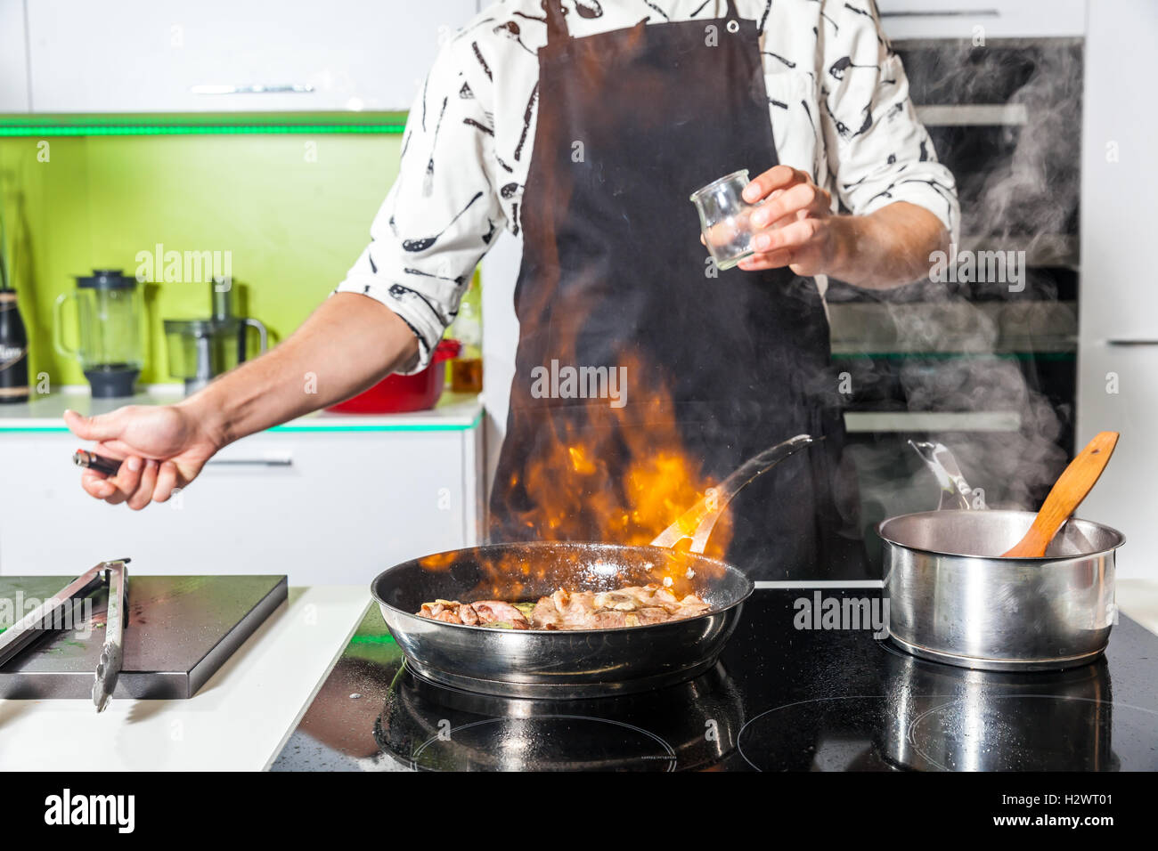 Man cooking at home Stock Photo - Alamy