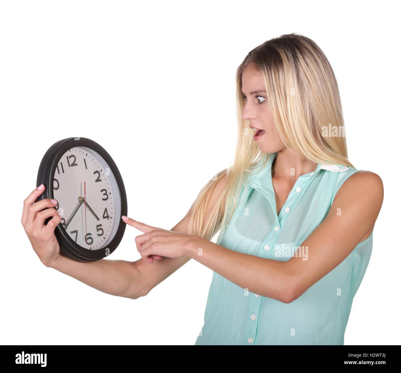 Pretty Lady Pointing to Clock Stock Photo - Alamy