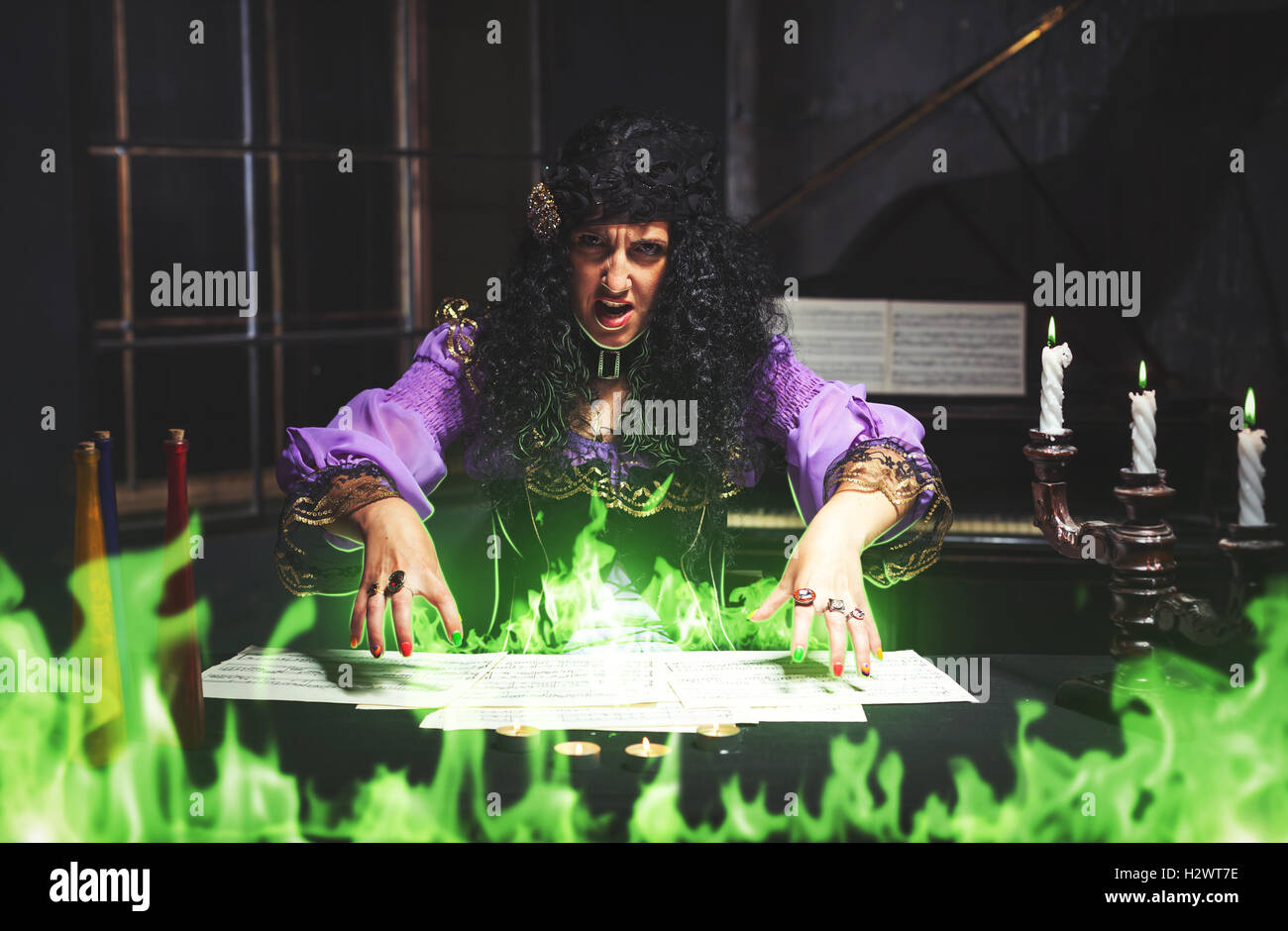 Adult sorceress practising witchcraft Stock Photo - Alamy