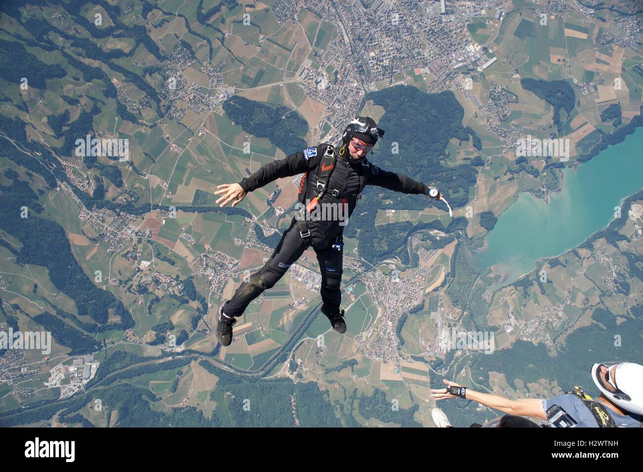 Skydiver flying on his back above Gruyeres Stock Photo - Alamy